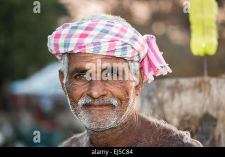 Keralan lifestyle: friendly local fisherman with chequered turban poses ...