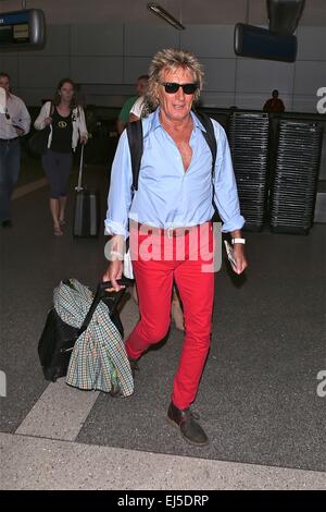 Rod Stewart wearing red trousers arrives Los Angeles International ...