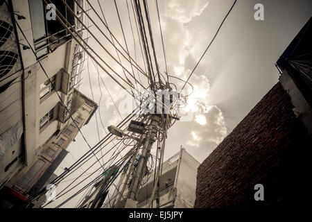 Interlacing of wires. Urban indian electricity pole Stock Photo - Alamy