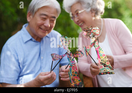 The old couple took the shadow puppet Stock Photo - Alamy