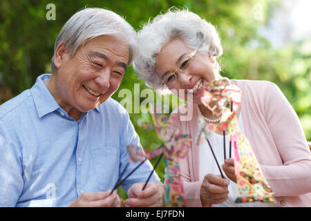 The old couple took the shadow puppet Stock Photo - Alamy