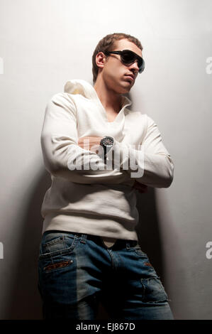 man with athletic standing near a wall Stock Photo - Alamy