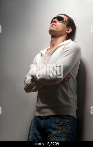 Professional male standing near wall in the business center Stock Photo ...
