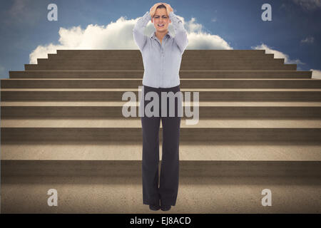 Composite image of desperate businesswoman Stock Photo - Alamy