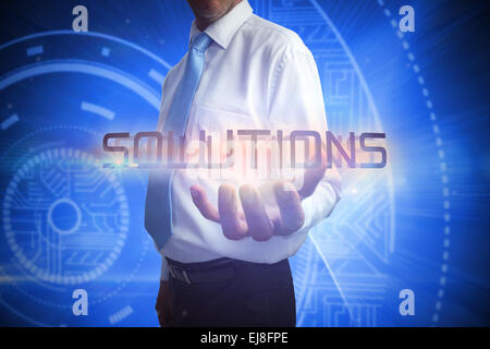 Businessman presenting the word solutions Stock Photo - Alamy