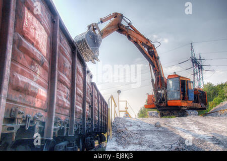 excavator loads gravel Stock Photo - Alamy