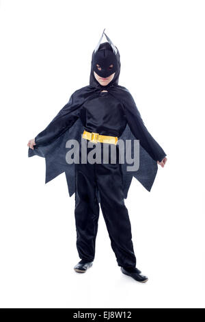 Halloween. Little boy dressed as Batman sits on his dad's neck ...