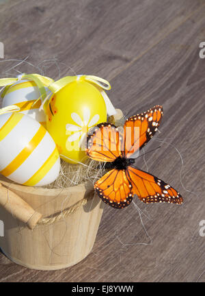 easter eggs with butterfly in a basket Stock Photo - Alamy