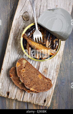Sprat preserved fish in metal can on white Stock Photo - Alamy