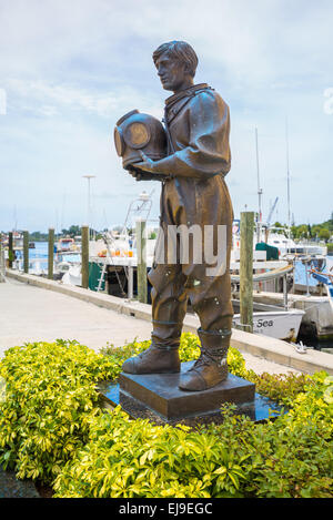 Bronze statue of sponge diver in diving suite with nets at Kalymnos ...