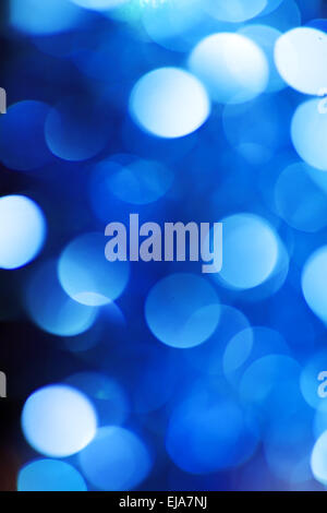Blue unfocused background with colored christmas tree Stock Photo - Alamy