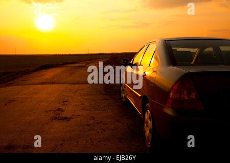 Car at sunset Stock Photo - Alamy