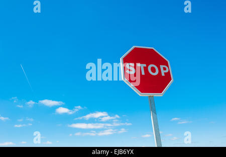 Stop sign over blue sky Stock Photo - Alamy