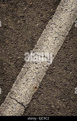 Diagonal line on a white plaster wall with two colors - light texture ...