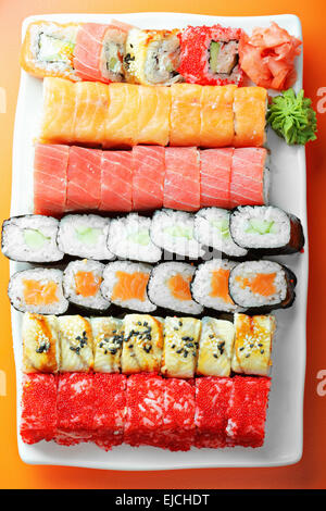 Above view of various sushi and rolls placed on stone board. Japanese ...