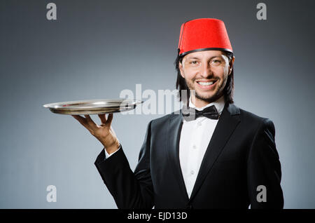 Waiter wearing traditional turkish hat Stock Photo - Alamy