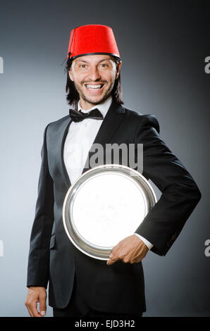 Waiter wearing traditional turkish hat Stock Photo - Alamy
