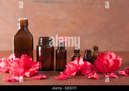 essential oil azalea flowers on dark rustic background Stock Photo - Alamy