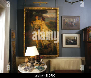 A Victorian style domestic interior with a large fireplace, and ...