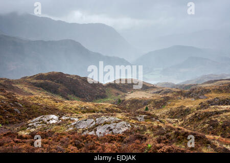Dramatic rainy weather in Snowdonia. Rain falling on hills and ...