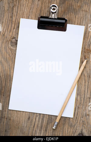 Clipboard with Blank Paper on Wooden Table Stock Photo - Alamy