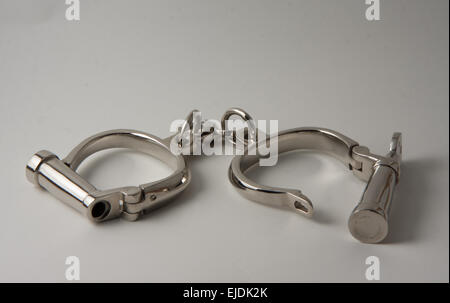 old handcuffs with locking screw English style Stock Photo - Alamy