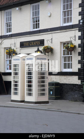 Cream telephone boxes in Beverley Stock Photo - Alamy