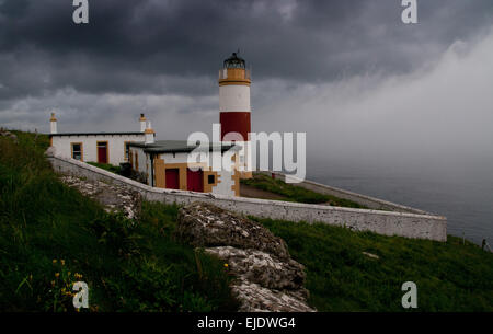 Clyth Ness lighthouse on the north east coast of Scotland, sea fog or ...