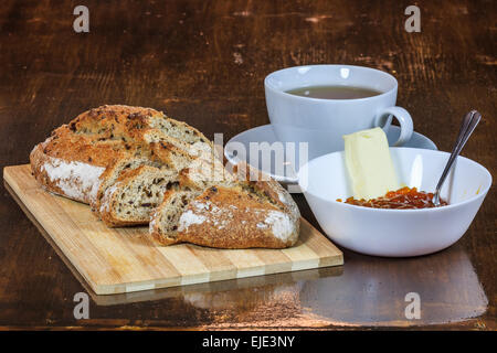Delicious toast with jam and cup of tea on table close-up Stock Photo ...