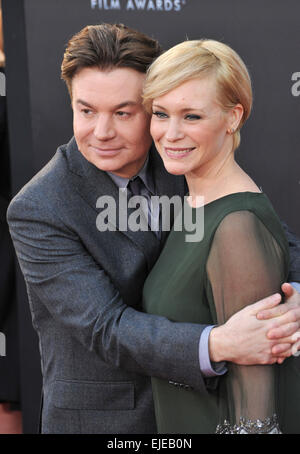 Actor Mike Myers and Kelly Tisdale attend the Vanity Fair Oscar Party ...
