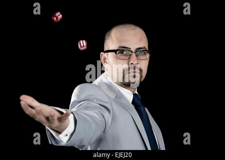 a man throwing dice Stock Photo - Alamy