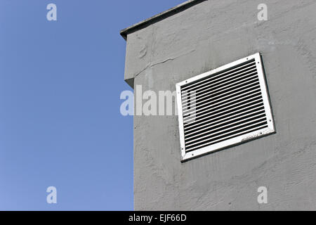 Vent window on gray concrete wall Stock Photo - Alamy