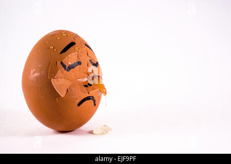 A sad egg on White background Stock Photo - Alamy