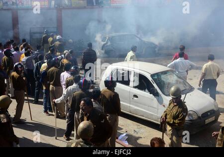 Allahabad, India. 11th Mar, 2015. Police opens an air fire during clash ...