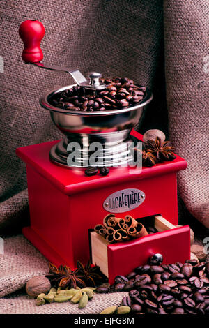 coffee beans cinnamon and coffee grinder Stock Photo - Alamy