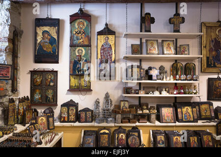 Display of Greek souvenirs religious icons on rack in downtown shopping ...