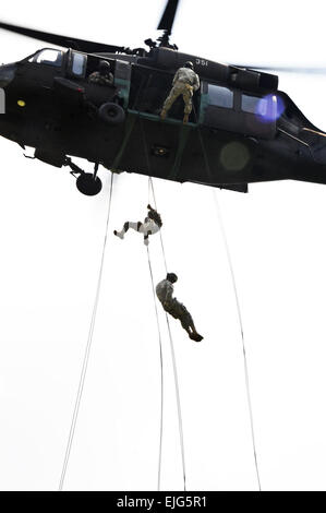 Soldier rappelling out of Black Hawk helicopter at the Gowen Thunder ...