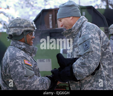 Gen. Raymond Odierno presents Sgt. Jeremiah Fogle his coin. Sgt ...