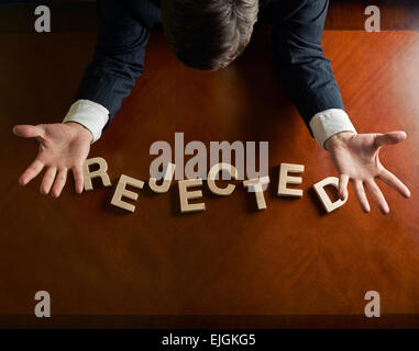 Word Rejected and devastated man composition Stock Photo - Alamy