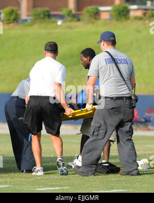 Medical personnel transport injured football player off the field on a ...