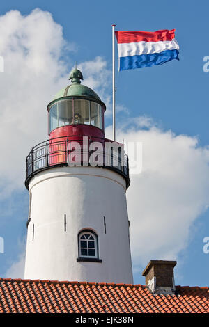 Historic lighthouse with the dutch flag in Urk, Netherlands Stock Photo ...