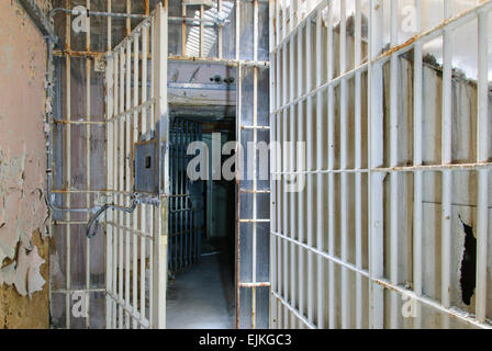 Metal barred gates inside an old prison Stock Photo - Alamy