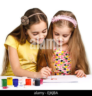 Two little sisters painting colorful Easter eggs at home Stock Photo ...