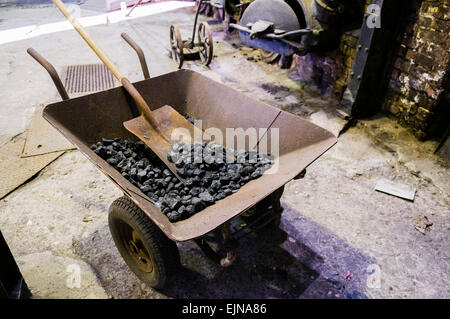 Old wheelbarrow used bringing coal Stock Photo - Alamy