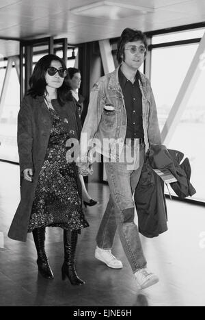 Former Beatle John Lennon with his wife Yoko Ono leaving Heathrow Airport for the Cannes Film ...