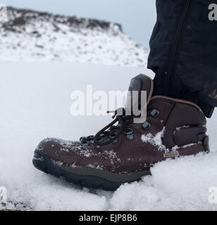 Hiking boot in the snow Stock Photo - Alamy