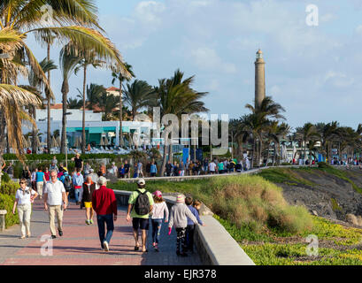 Promenade and lighthouse Faro de Maspalomas in the evening, Maspalomas ...