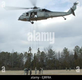 U.S. Army Soldiers rappel out of a UH-60 helicopter on April 20 at Camp ...