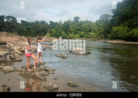 Fishing in the upper Coppename River, Central Suriname Nature Reserve ...