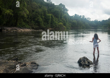 Fishing in the upper Coppename River, Central Suriname Nature Reserve ...